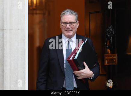 London, UK. 10 January 2026. Kurdish demonstrators hold flags and ...