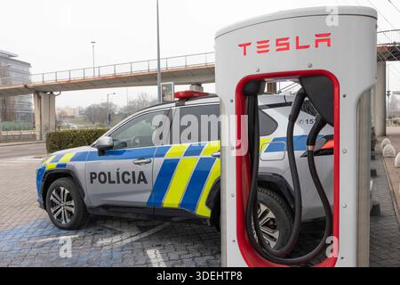 Slovak Police car is being charged at a Tesla charging station in ...