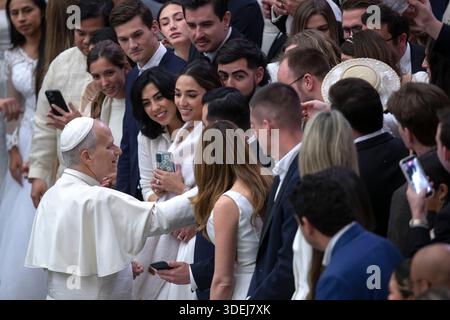 Pope Leo XIV greets the newlyweds during his weekly general audience in ...