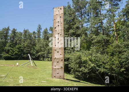 Artificial rock climbing wall outdoor on mountain meadow Stock Photo ...
