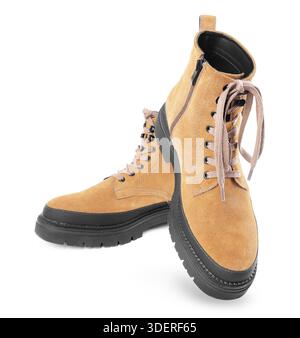 beige boots. ankle boots on yellow background. shoe store. shopping ...