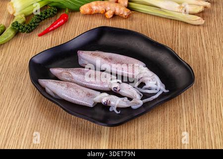 Raw fresh young calamari or squid for cooking Stock Photo - Alamy