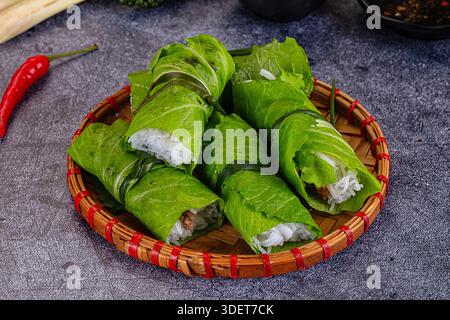 Vietnamese stuffed green nem spring rolls in leaf Stock Photo - Alamy