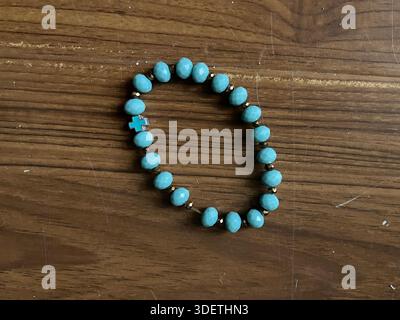 the rosary and new testament on the bench in old church Stock Photo - Alamy