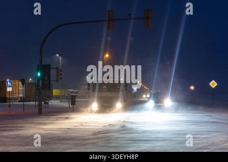 Magdeburg, Germany. 9th Jan 2026. Cars drive through blizzard ...