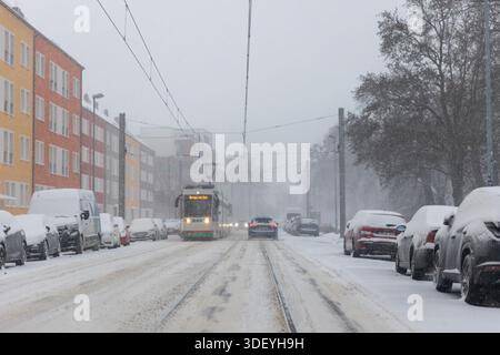 Magdeburg, Germany. 9th Jan 2026. Cars drive through blizzard ...