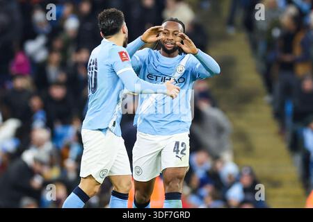Rayan Cherki of Manchester City gestures scores a GOAL 2-0 and ...