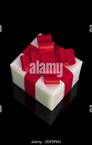 Gift with red bow on metallic background copyspace holidays concept ...