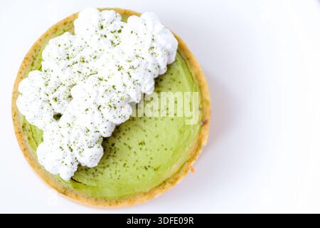 Matcha cheese tart on a white plate Stock Photo - Alamy