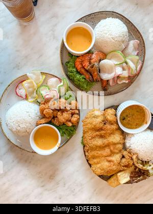 A vibrant bowl of spicy orange shrimp curry, served in a traditional ...