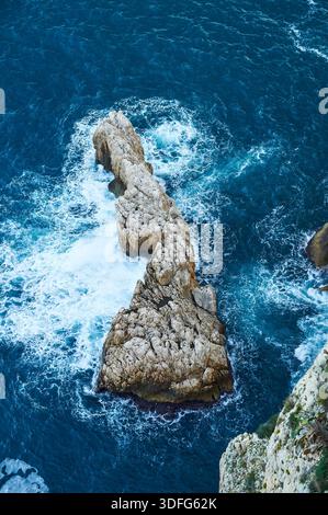 Rocks by the sea with waves of the Mediterranean sea next to the Cabo ...