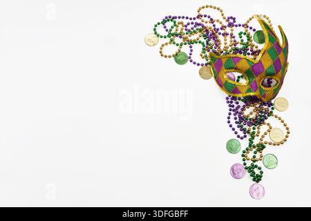Mardi Gras beads in glittering yellow, green, purple, and gold ...