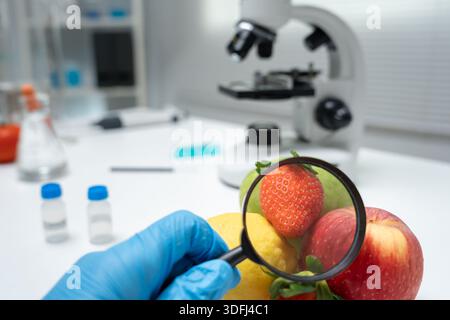 Scientist use magnifying glass to check physical occur from chemical on ...
