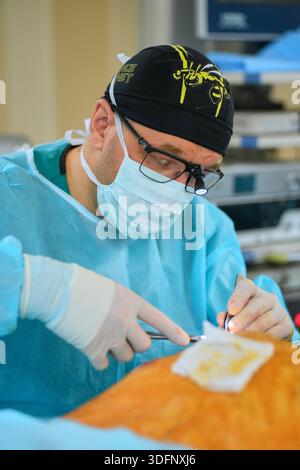 plastic surgeon works in the operating room Stock Photo - Alamy