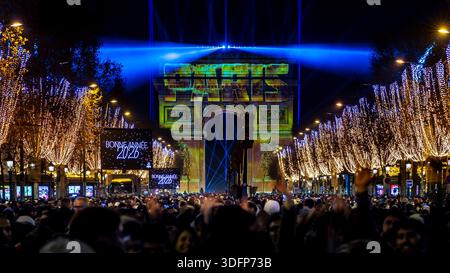 Paris, France - January 1, 2026: The crowd gathered on the Champs ...