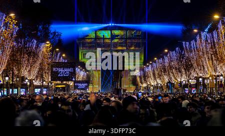 Paris, France - January 1, 2026: The crowd gathered on the Champs ...