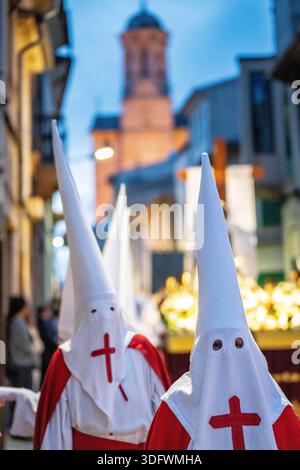 Hooded brothers with conical hats that serve as masks, Holy Week ...
