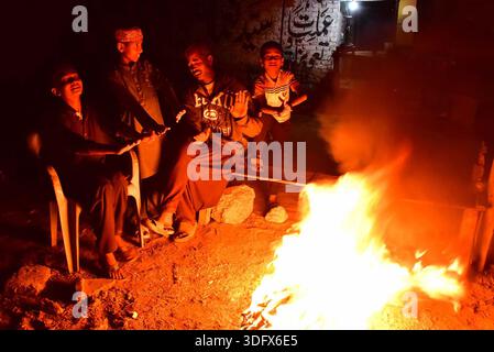 People are warming their hands on bone-fire to save themselves from ...