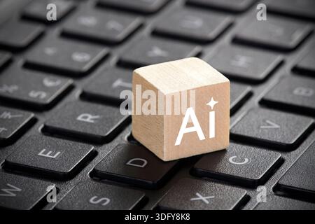 Wooden block with symbol of artificial intelligence concept on laptop ...