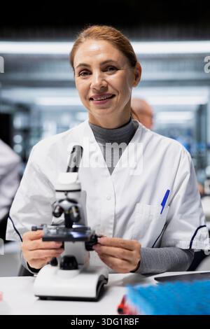 Scientist Observing Specimen Through Microscope in Laboratory Setting ...