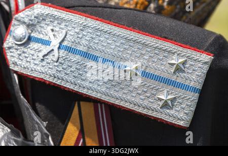Shoulder strap on russian cossacks traditional uniform Stock Photo - Alamy