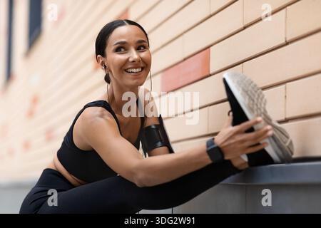 Muslim Woman Athlete Stretching on Running Track in Hijab at Outdoor ...