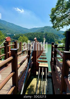 Majang Reservoir Red Suspension Bridge Stock Photo - Alamy