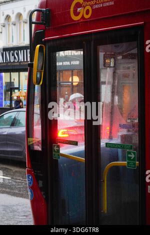 Wimbledon, South West London. 16th January 2026. Commuters shield ...