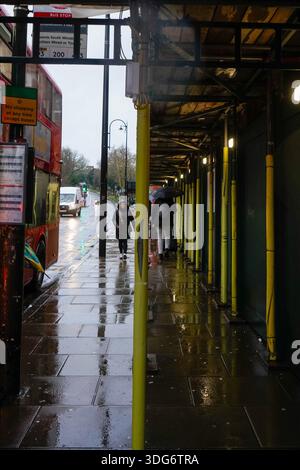 Wimbledon, South West London. 16th January 2026. Commuters shield ...