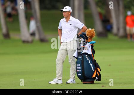 January 15, 2026 - Collin Morikawa walks alongside his caddie Mark ...