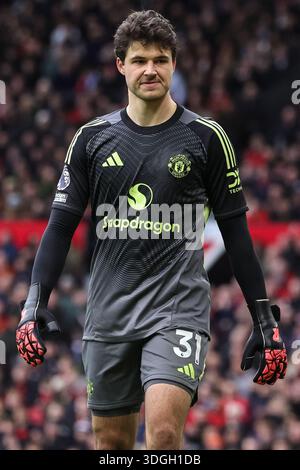 Manchester United goalkeeper Senne Lammens (31) punches the ball clear ...