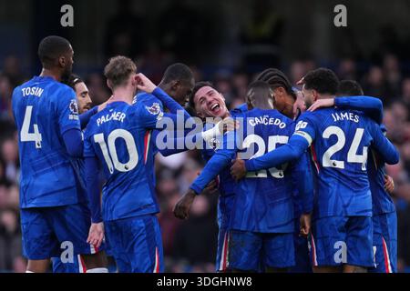 Enzo Fernández of Chelsea laughs as Chelsea players celebrate 1-0 lead ...