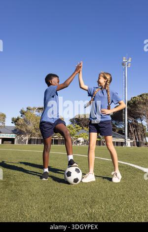 soccer players - female and male at soccer stadium. ready for game in ...