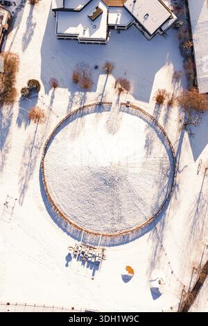 Aerial view of a circular Celtic burial mound in a green park ...