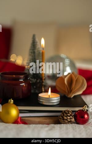 Cozy evening scene with candles, white wine glasses and warm candle ...
