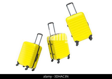 Set of colored plastic suitcases with handles and wheels lying ...