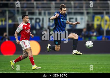 Gabriel of Arsenal FC competes for the ball with Achraf Hakimi of Paris ...