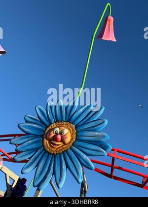 Brightly coloured fairground signs at Barry Island fun fair, South ...
