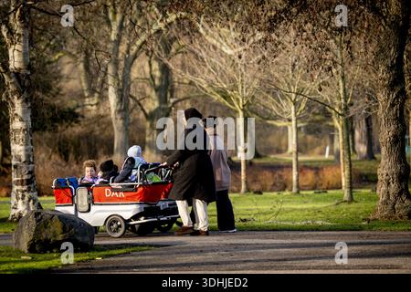 THE HAGUE - Childcare workers walk with children on the street ROBIN ...