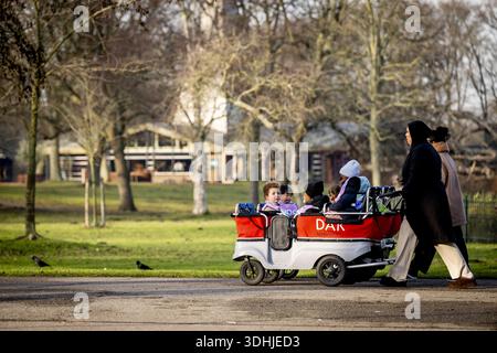 THE HAGUE - Childcare workers walk with children on the street ROBIN ...