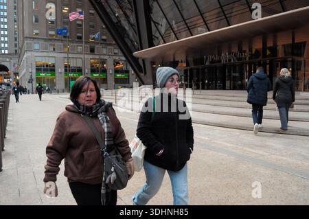 People walk outside of the JPMorgan Chase global headquarters building ...