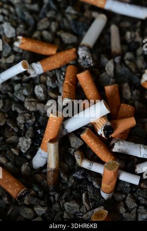 Several cigarettes seen in a concrete ashtray at the Alpe d'Huez ski ...