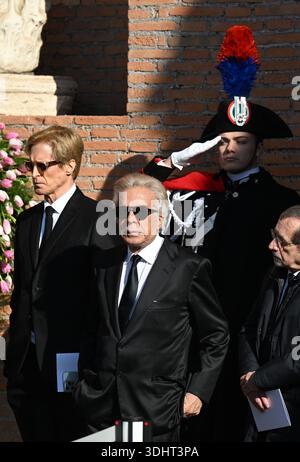 Bruce Hoeksema, left, and Giancarlo Giammetti leave after attending the ...
