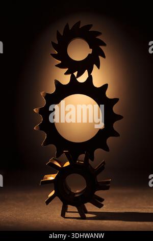 Wheels as gears, a balanced stack of three different metal cog wheels ...