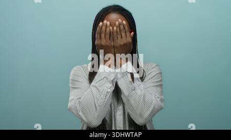 A woman poses with her face showing through a cardboard cutout during ...