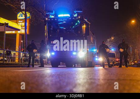 26 January 2026, Hamburg: A water police boat navigates through ice ...