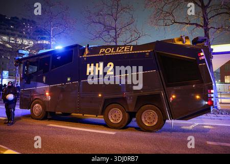 26 January 2026, Hamburg: A water police boat navigates through ice ...