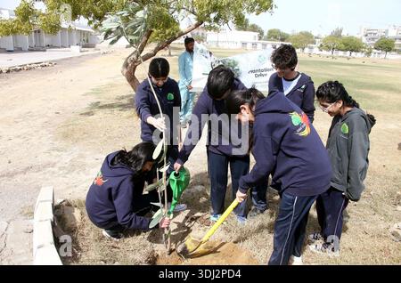 KARACHI, PAKISTAN, JAN 24: Students of Haque Academy School planting a ...