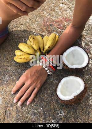 A close-up wellness scene showing a female hand gently playing a ...