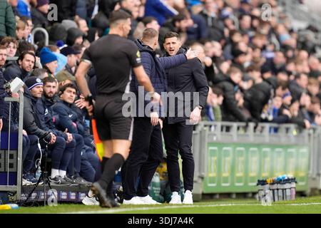Portsmouth manager John Mousinho (right) gestures on the touchline ...